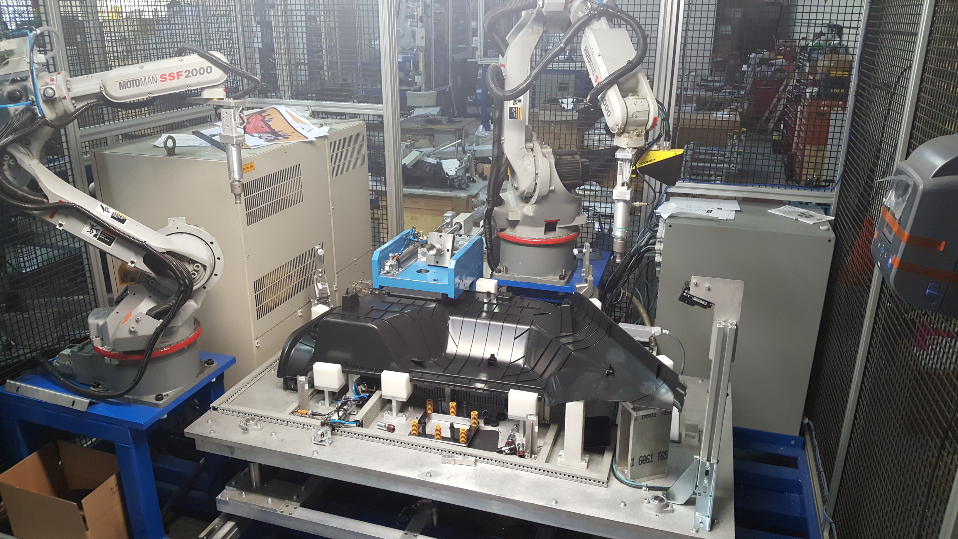 Robotic Cell - Two Robots, Ultrasonic welding and Punching Fixture ...